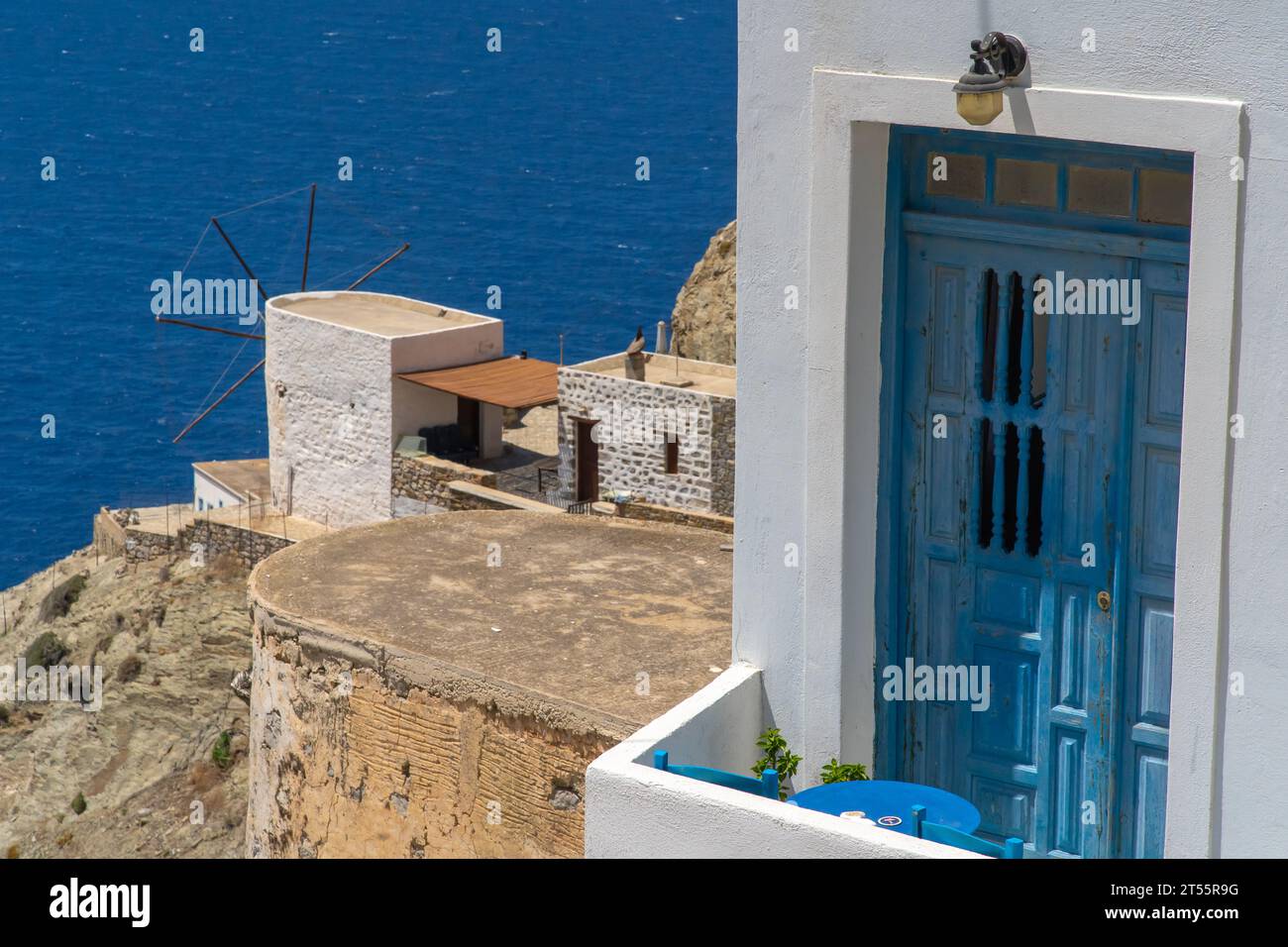 A house hanging over a cliff in Olympos,Karpathos Stock Photo - Alamy
