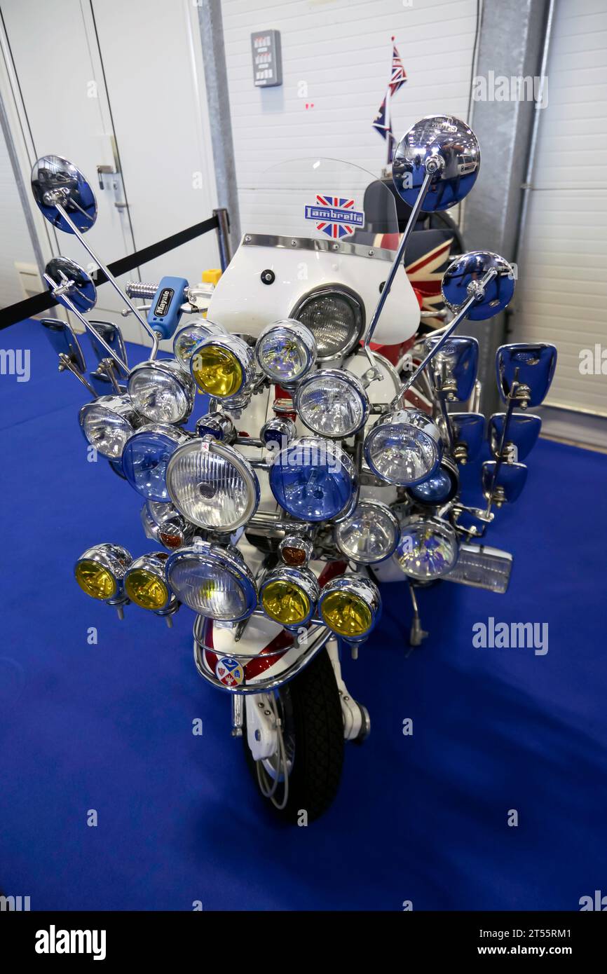 Close-up of a Lambretta covered with lights and wingmirrors, on display ...