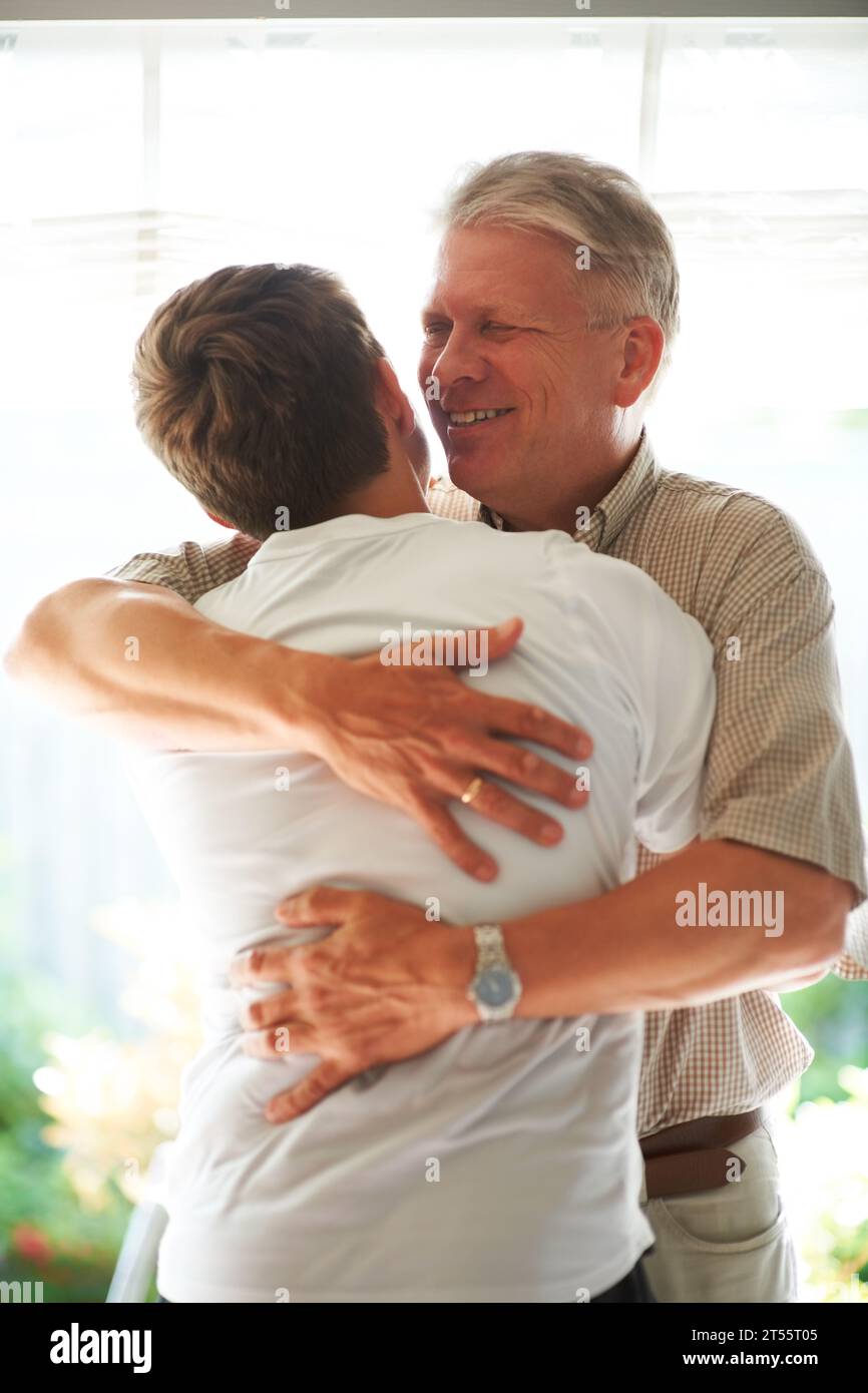 Grandfather, teenager and hug with smile, family and embrace with love ...