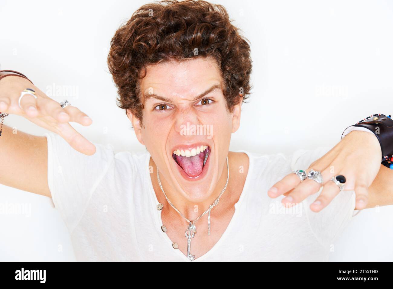 Portrait, energy and crazy with a man in studio isolated on a white ...