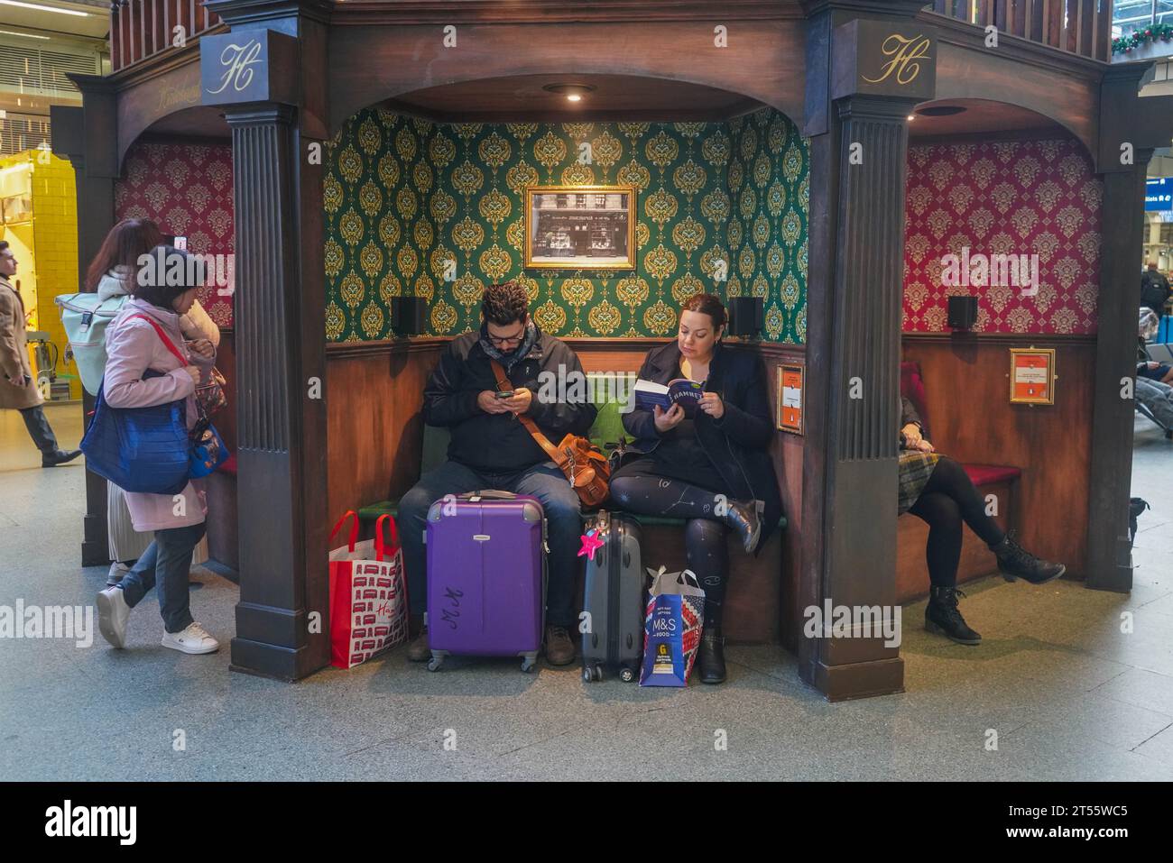 London, UK. 3 November 2023. Travellers sreading books in a cubicle . A ...