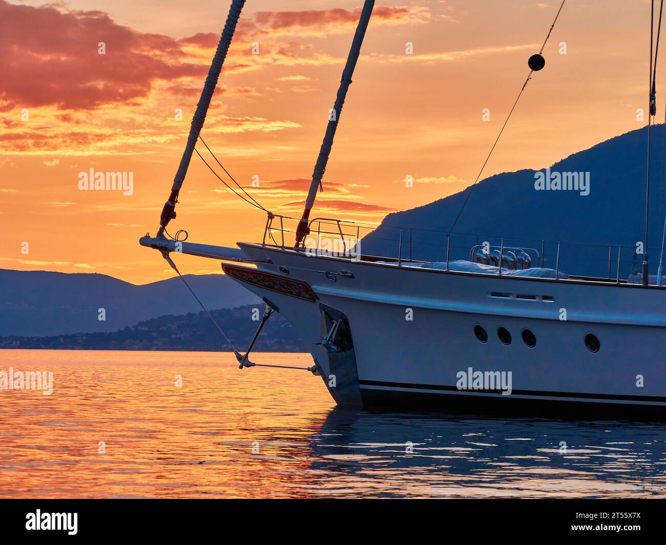 35 metre sailing yacht at sunset in the bay of Montenegro with hills in ...