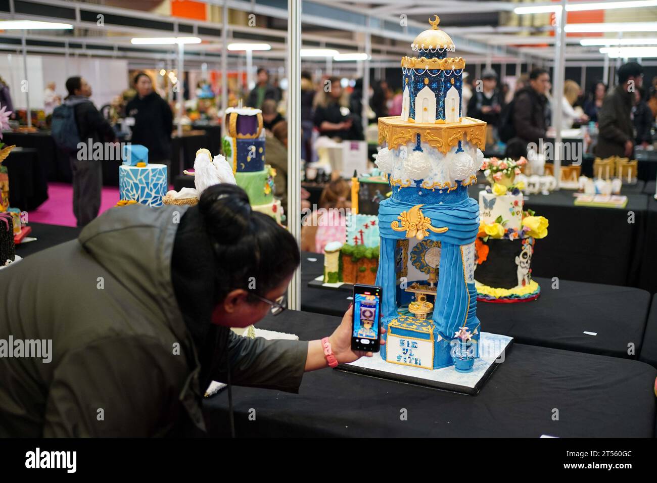 Visitors take photographs of creations entered for competition during ...