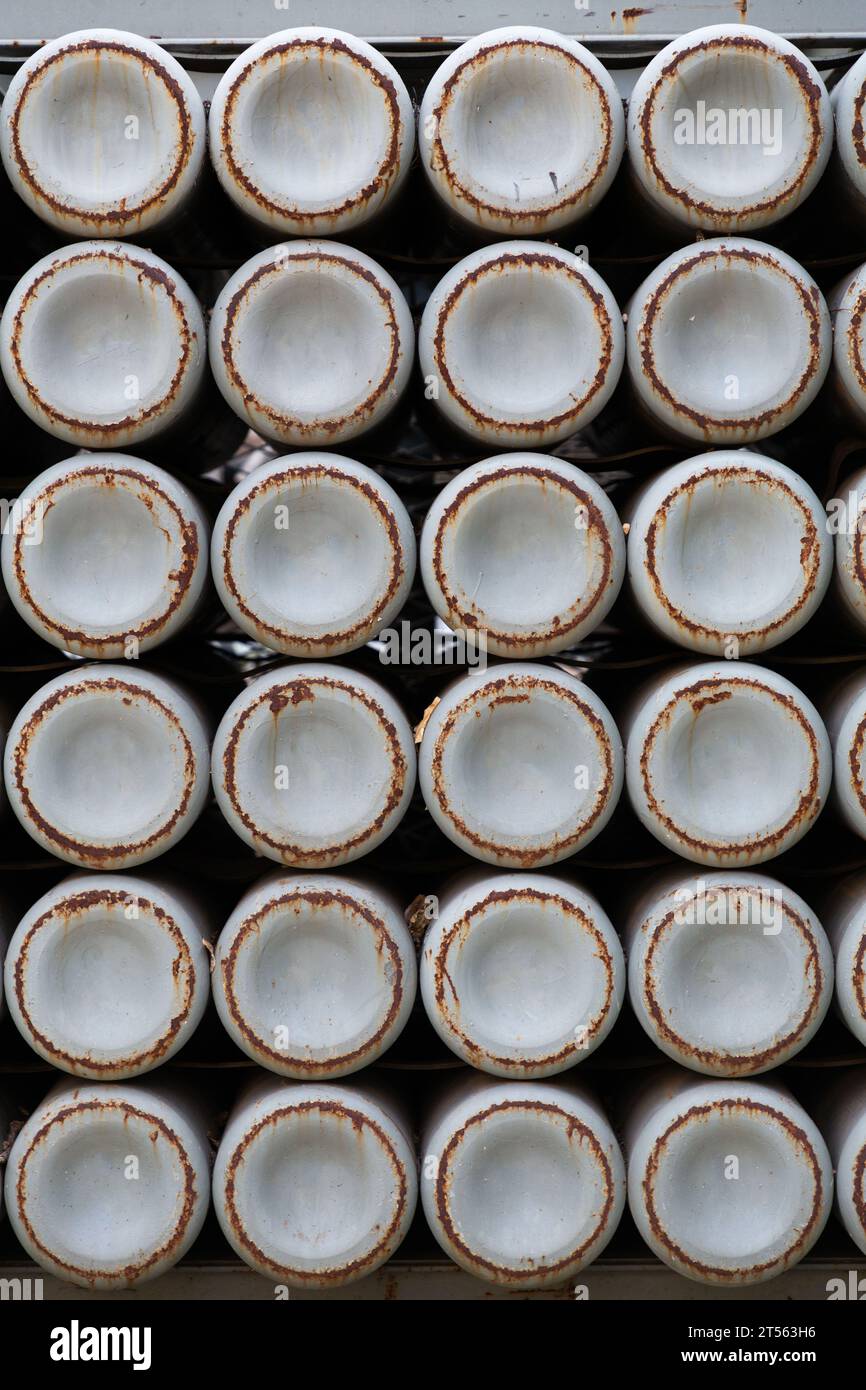 Stack of metal gas containers with oxidized rusty bottoms Stock Photo ...