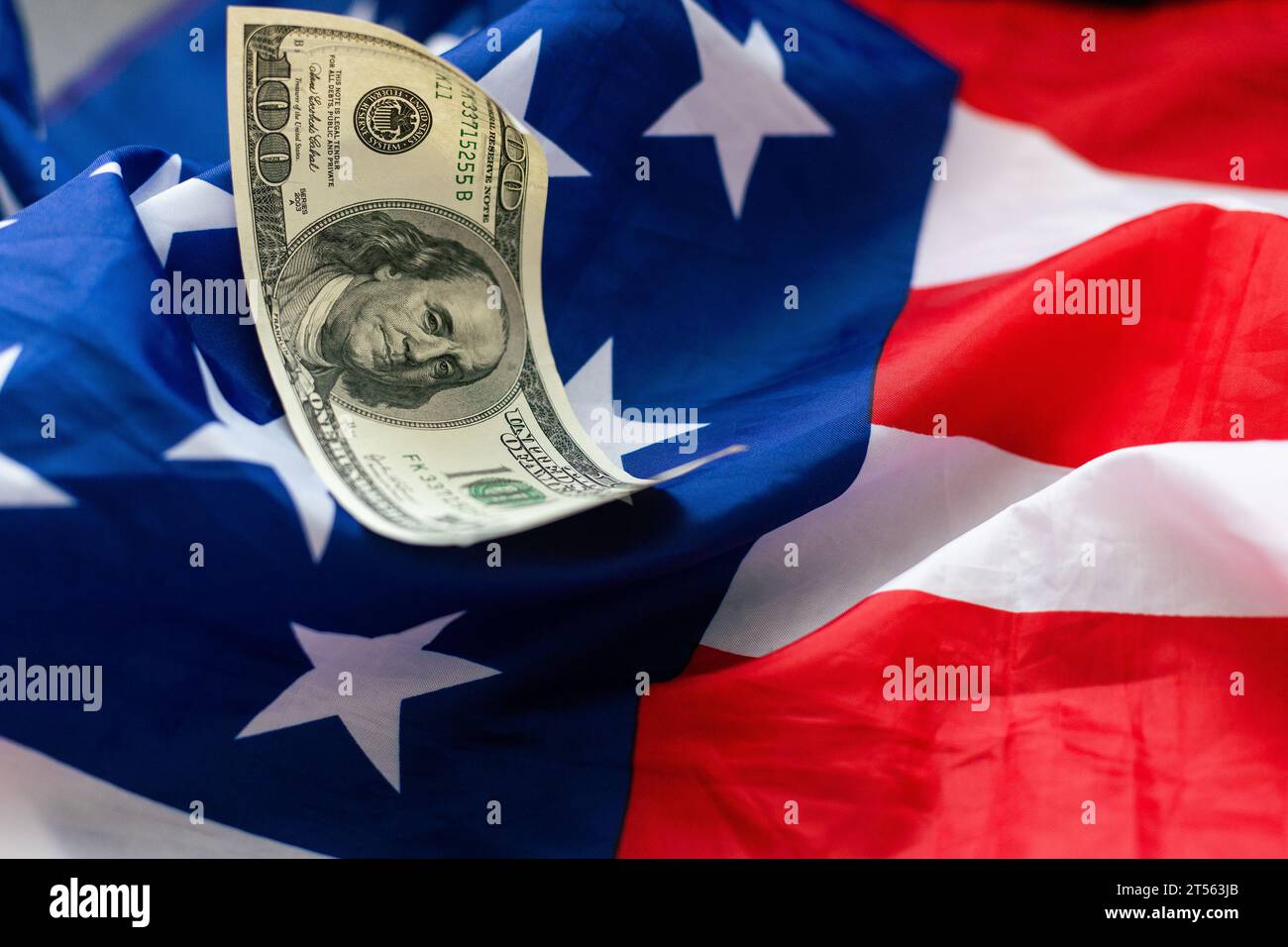 american money on american flag Stock Photo - Alamy