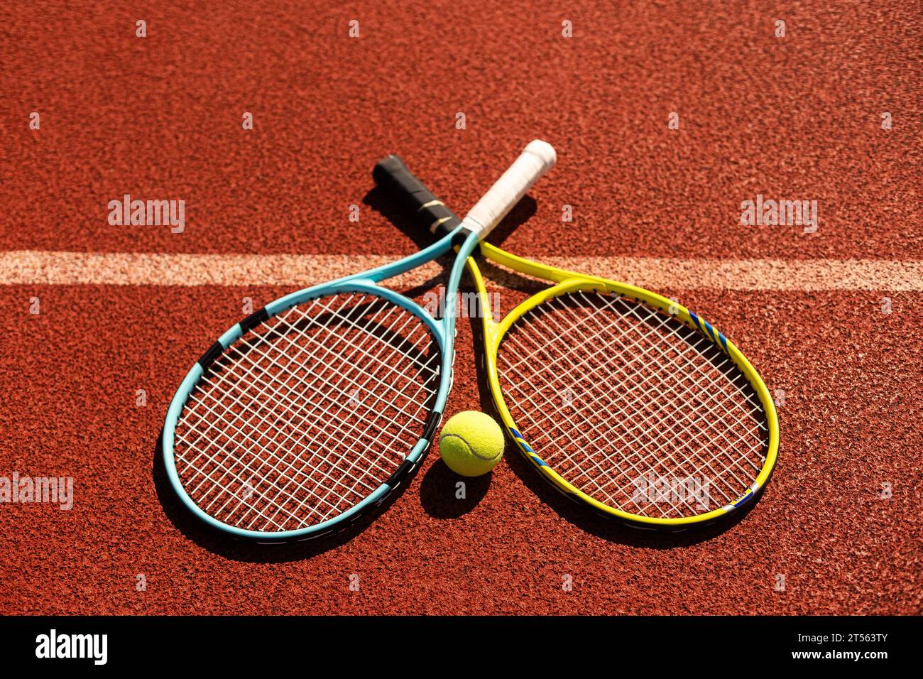 tennis racket and balls on the tennis court Stock Photo - Alamy