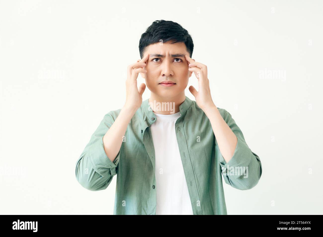 Depressed stressed. Young asian man hand touching headache on isolated ...