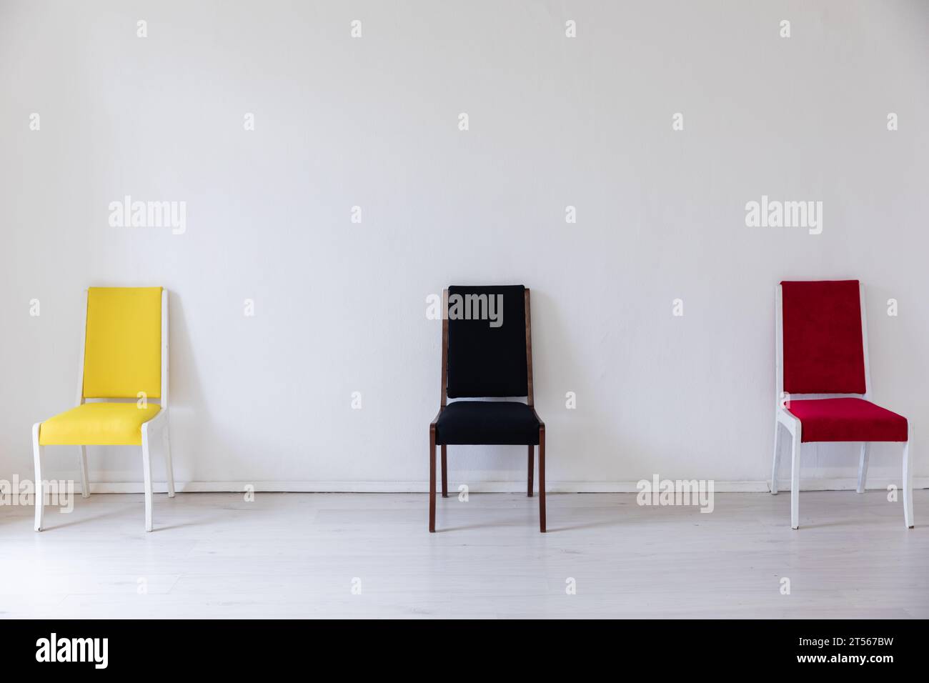 Three chairs in the interior of an empty white room Stock Photo - Alamy