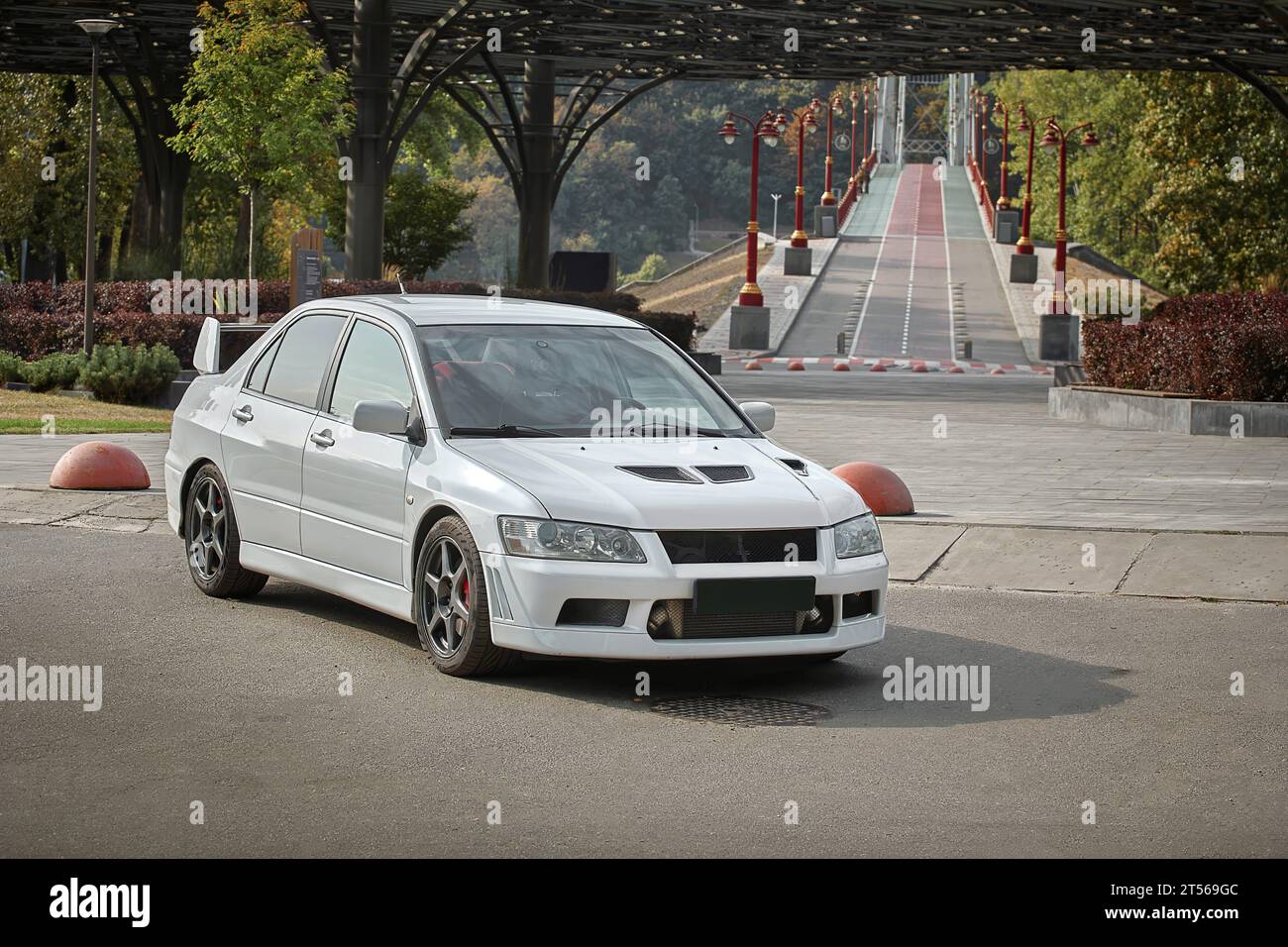 White car on a street background. Modern city sport car with a spoiler ...