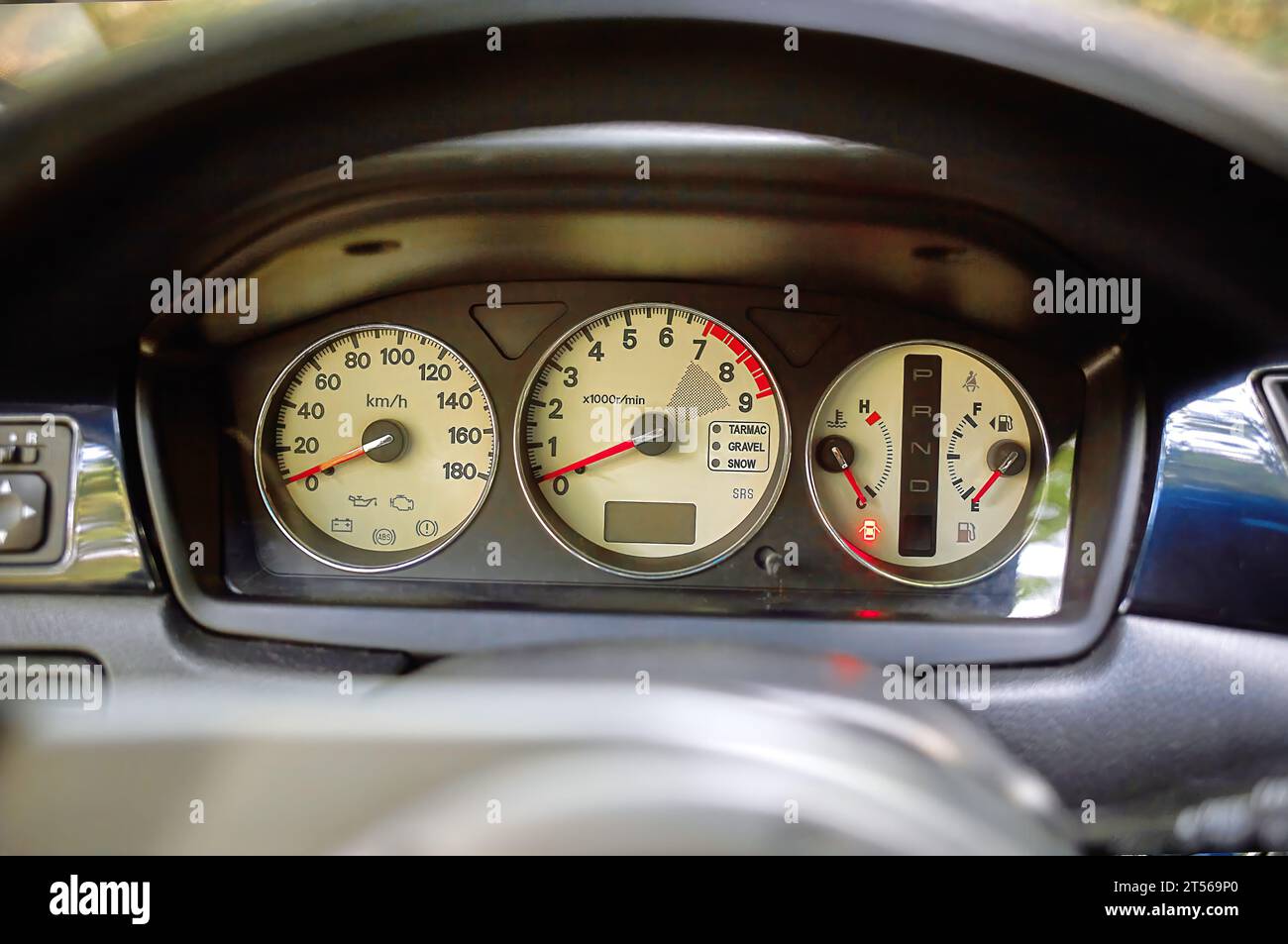 Car steering wheel and car sensors, inerior background, modern city car ...