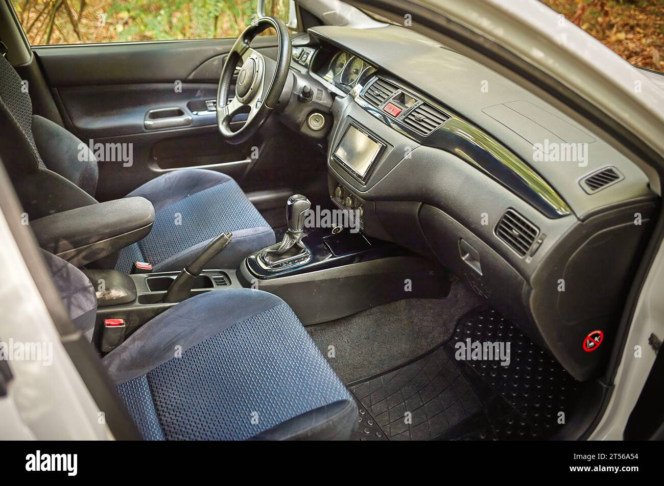 Car steering wheel and car sensors, inerior background, modern city car ...