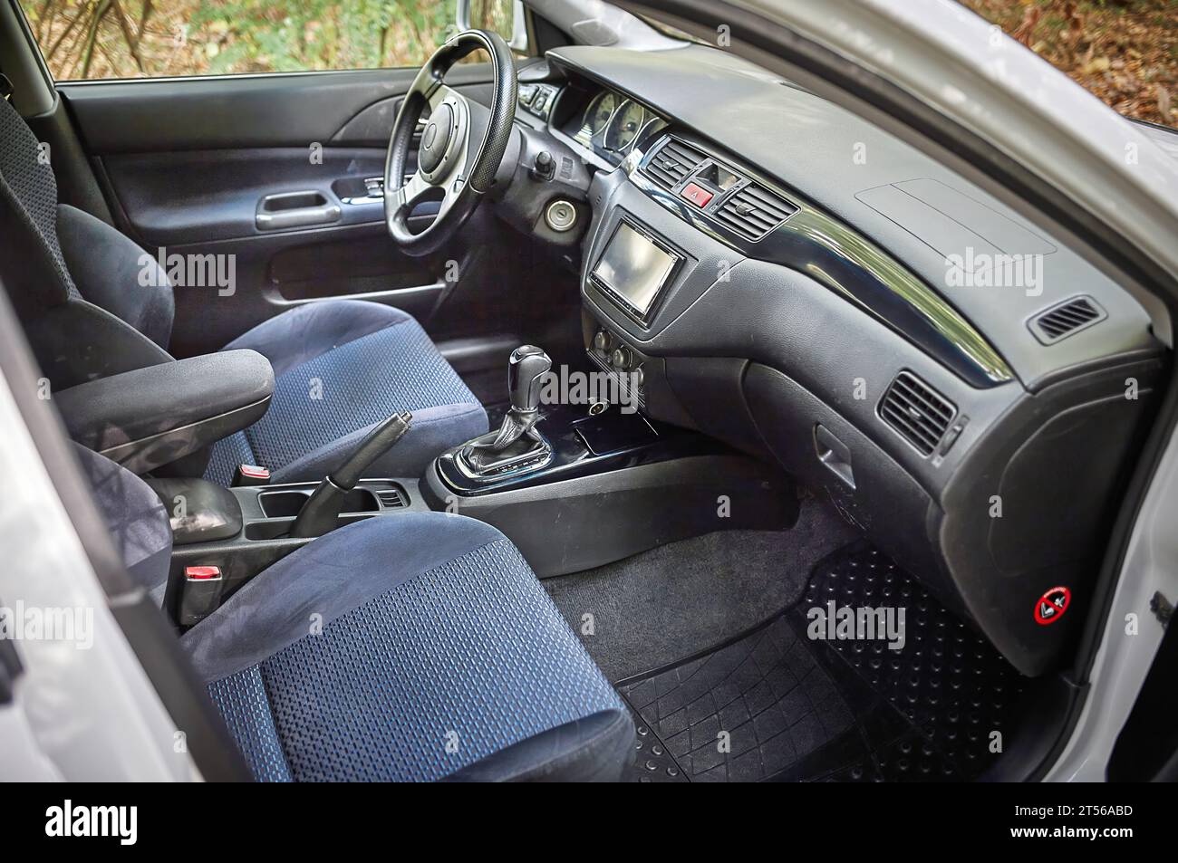 Car steering wheel and car sensors, inerior background, modern city car ...