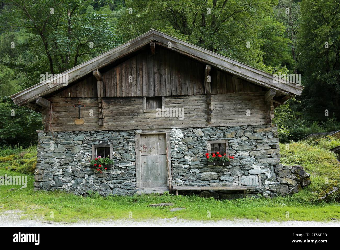 Alpine hut made of stone and wood in Pinzgau Stock Photo - Alamy