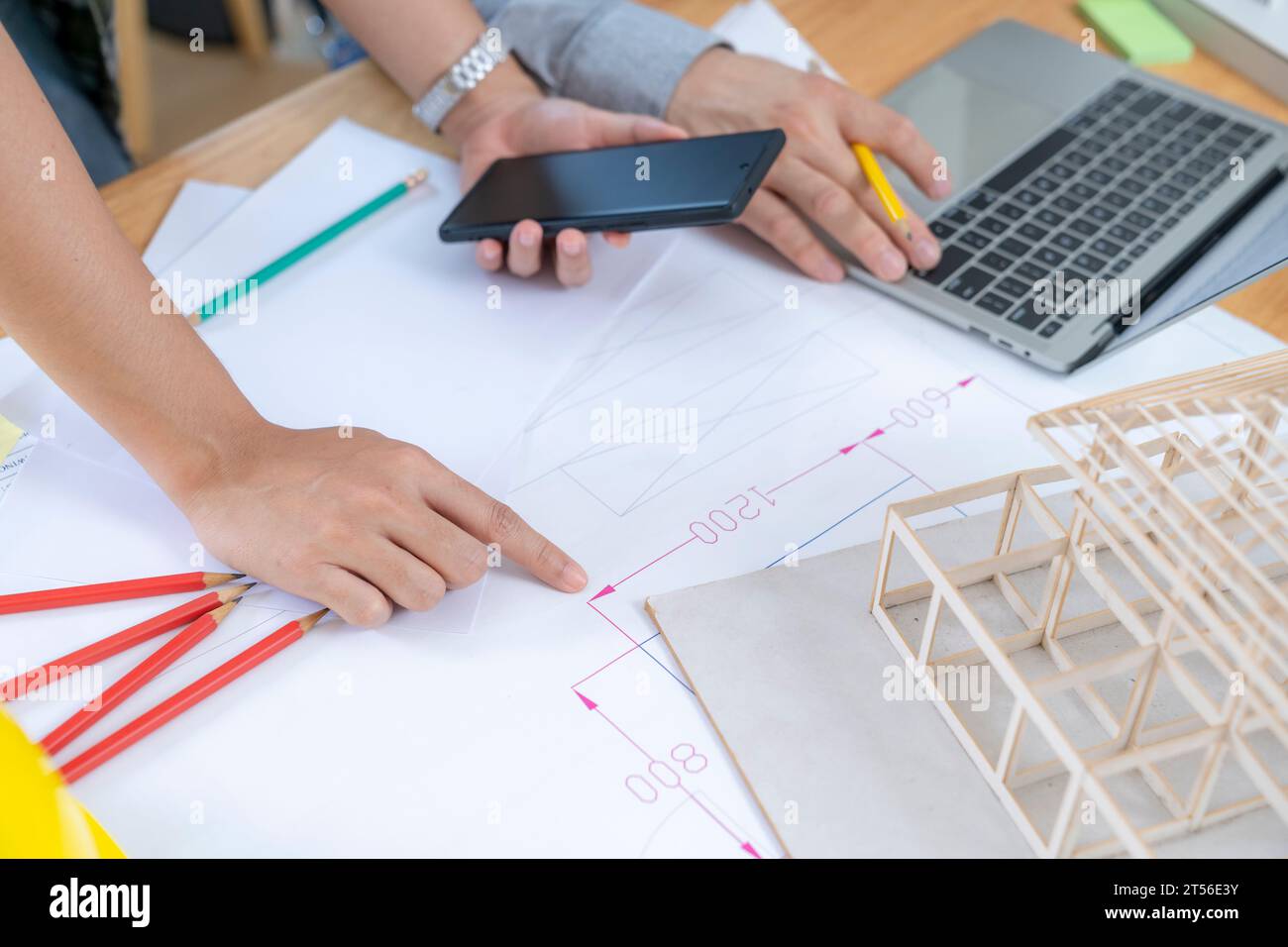 Female architect hands making model house, Construction concept of ...
