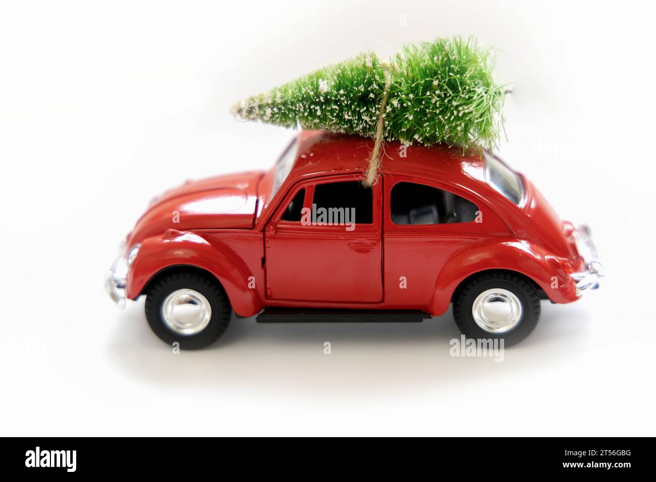 Vintage red car decor with Christmas Tree. Transporting Christmas tree ...