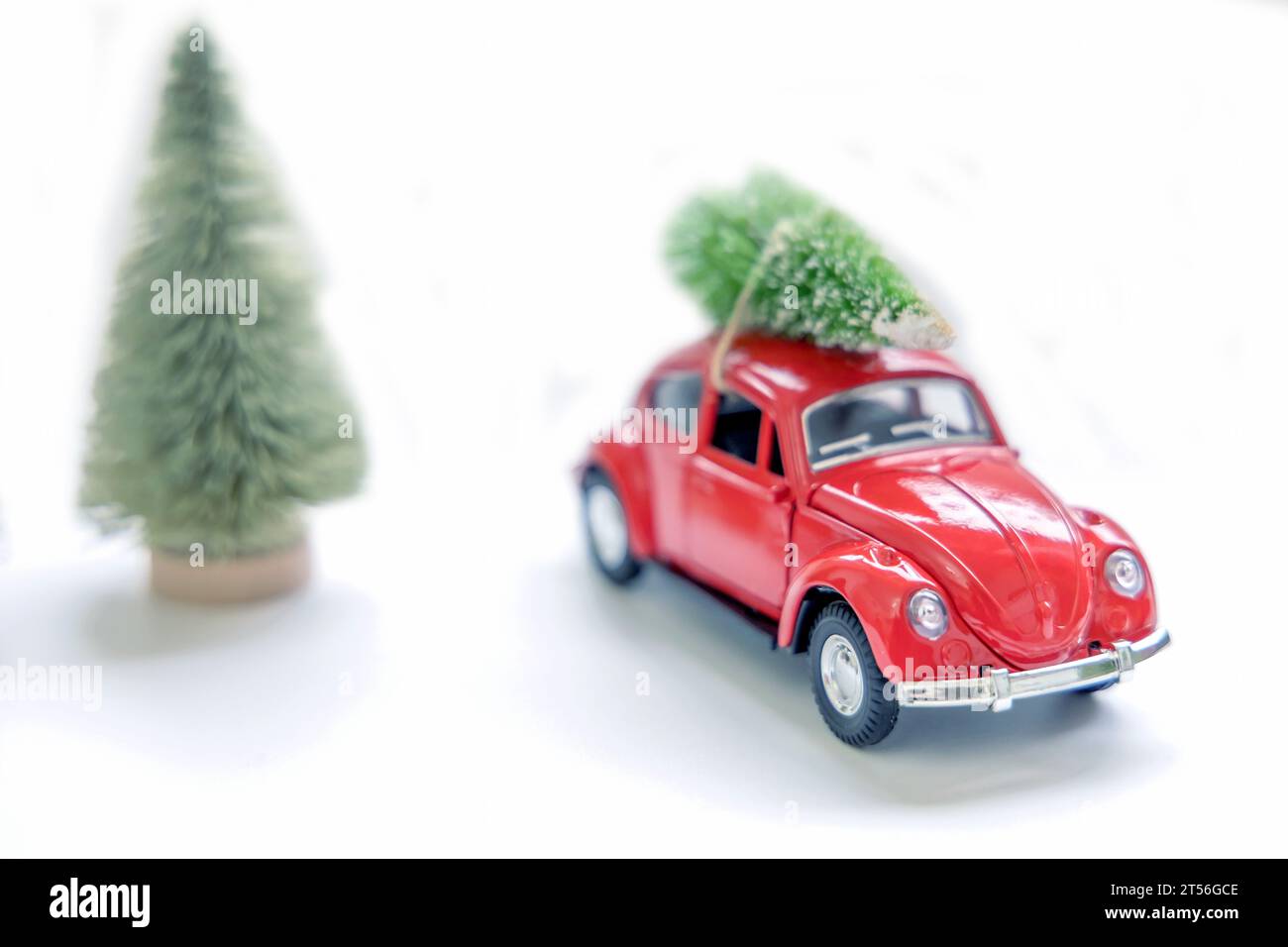Vintage red car decor with Christmas Tree. Transporting Christmas tree ...