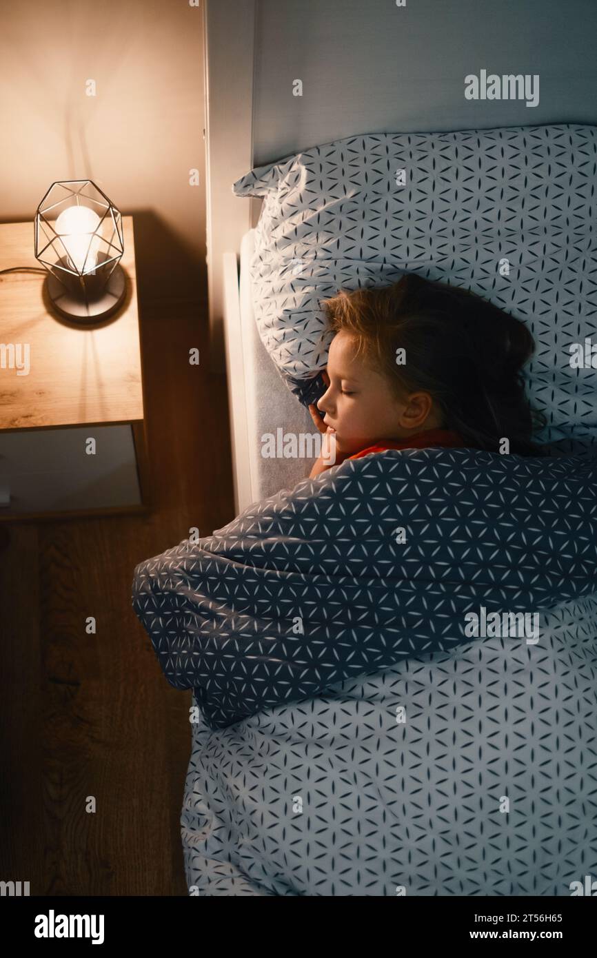 Child sleeping at night. Comfortable bed for kids. Toddler girl ...