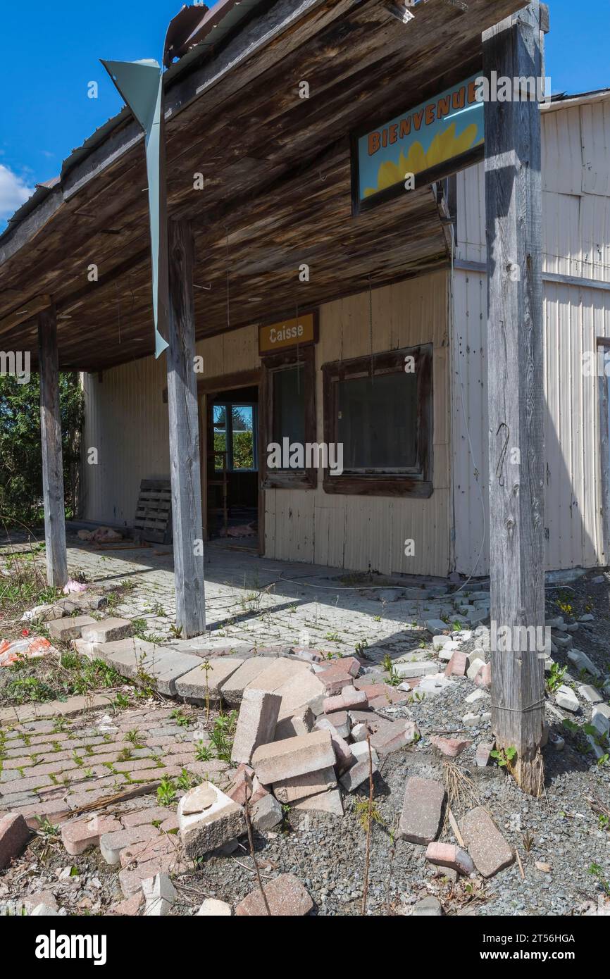 Partially demolished wood plank and sheet metal cladded commercial ...