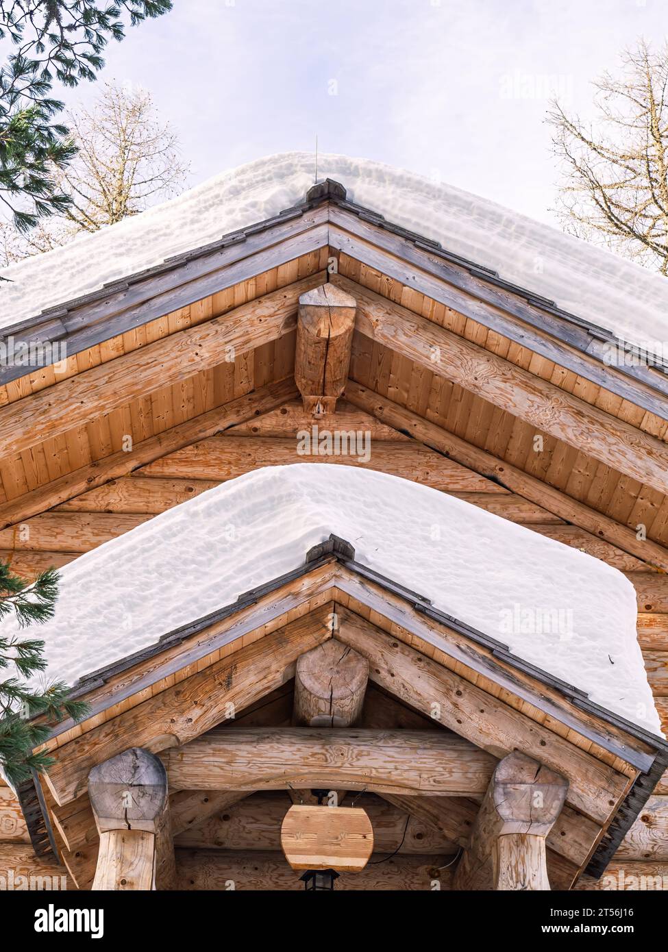 Wooden log house roof covered with thick deep snow, winter Stock Photo ...