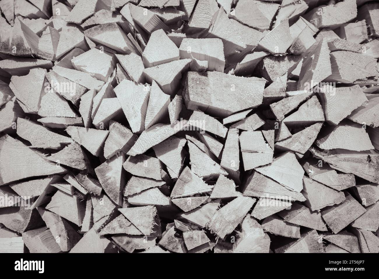 Stack of firewood, black and white. Chopped logs background. Woodpile ...