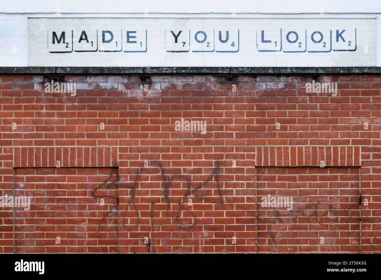 Graffiti, Scrabble letters Made you look, Brick wall, Portobello Road ...