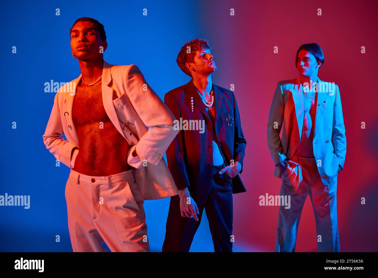 good looking elegant trio in classy suits with accessories with neon ...