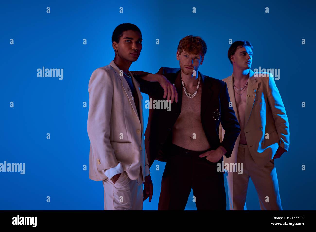 handsome diverse men posing actively in elegant suits with accessories ...