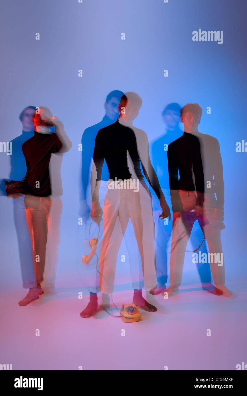 three multiethnic male models in black attires with retro phones, long ...