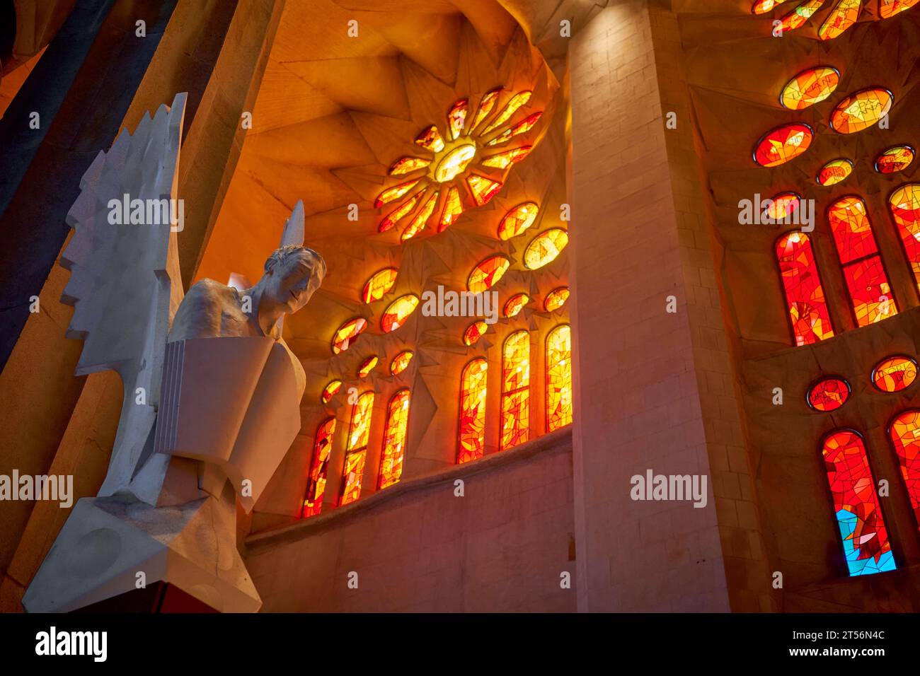 Sculpture of Saint Mathieu, Saint Matthew, in front of stained glass ...
