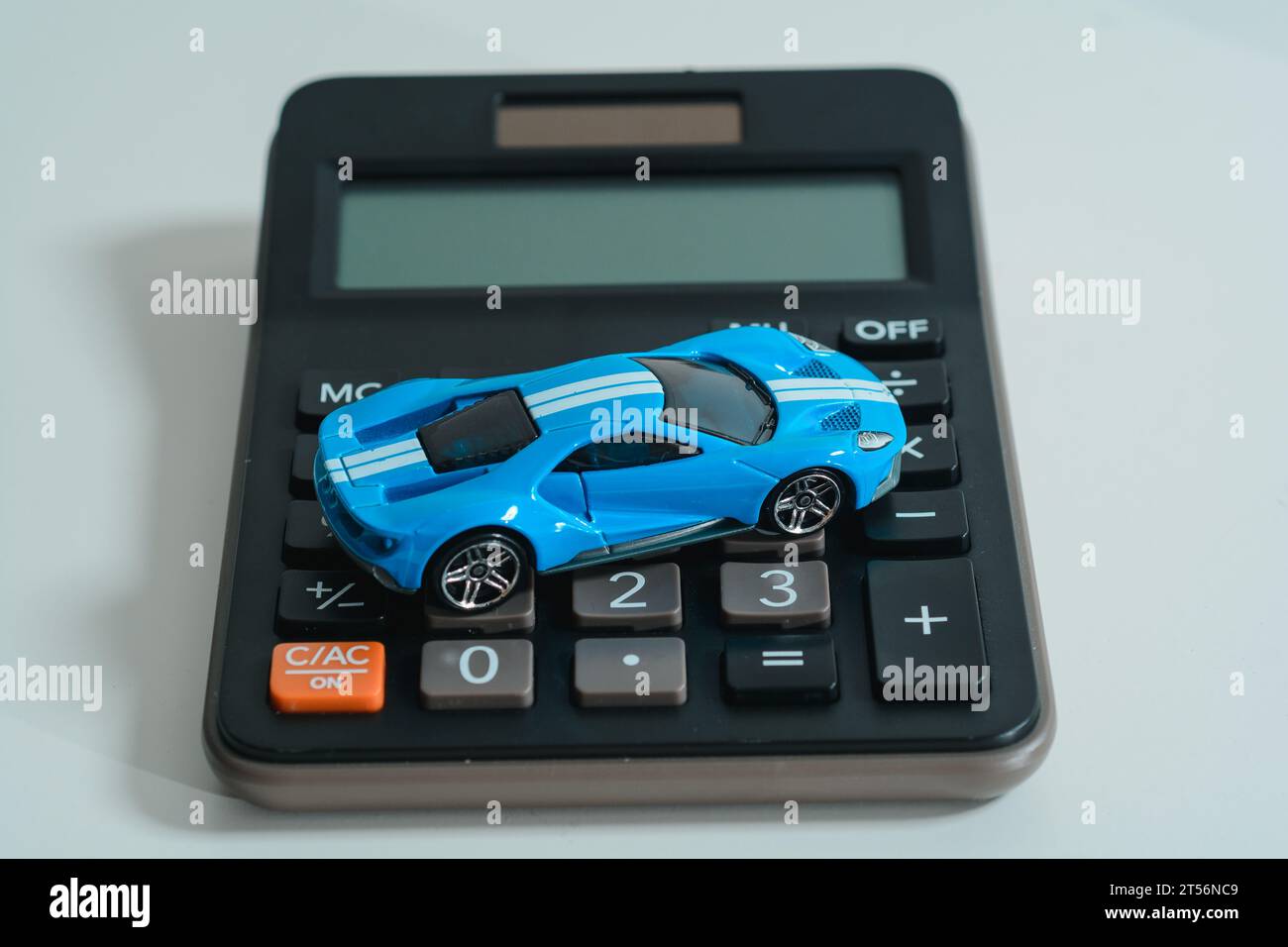 Car on calculator hi-res stock photography and images - Alamy