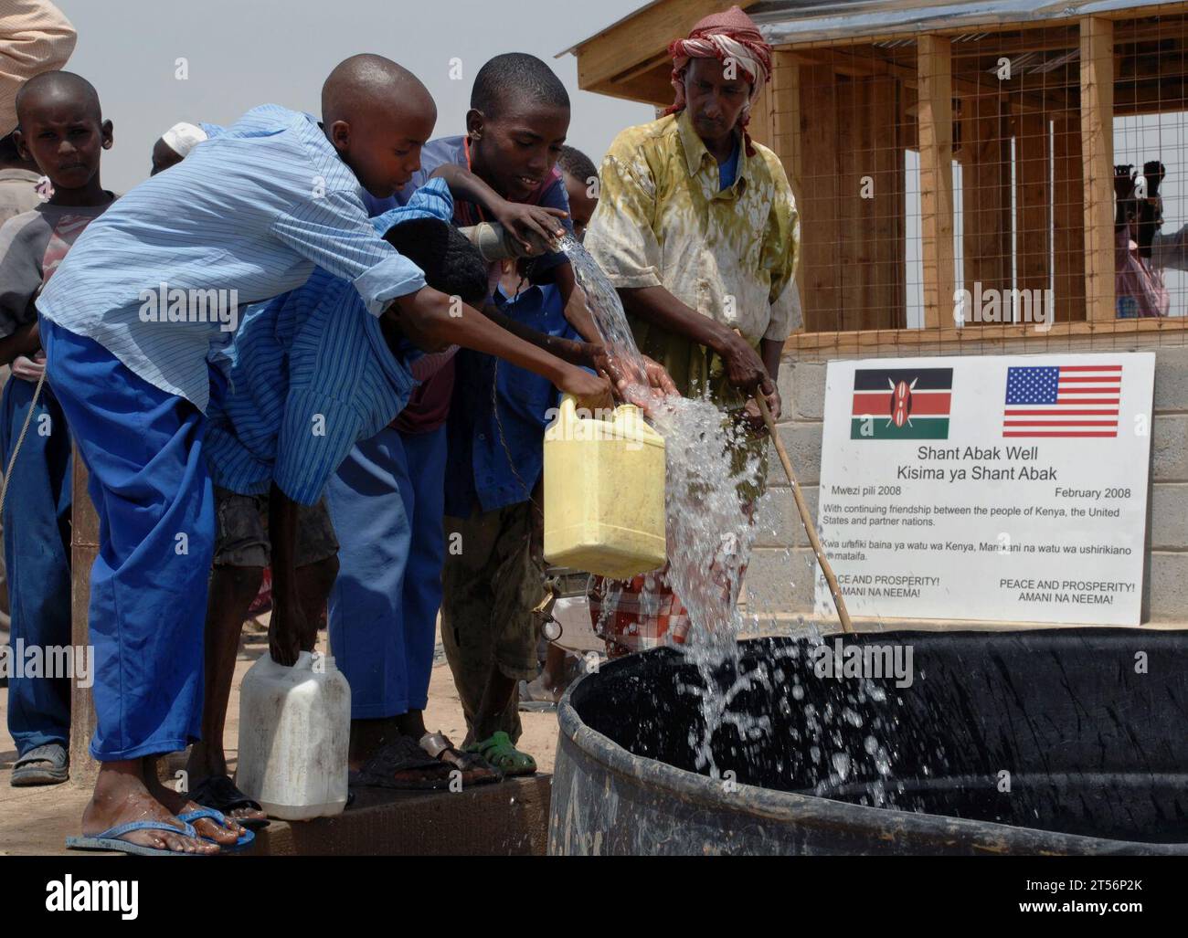 US Navy 0802087577K-063 Children get clean drinking water from a well ...