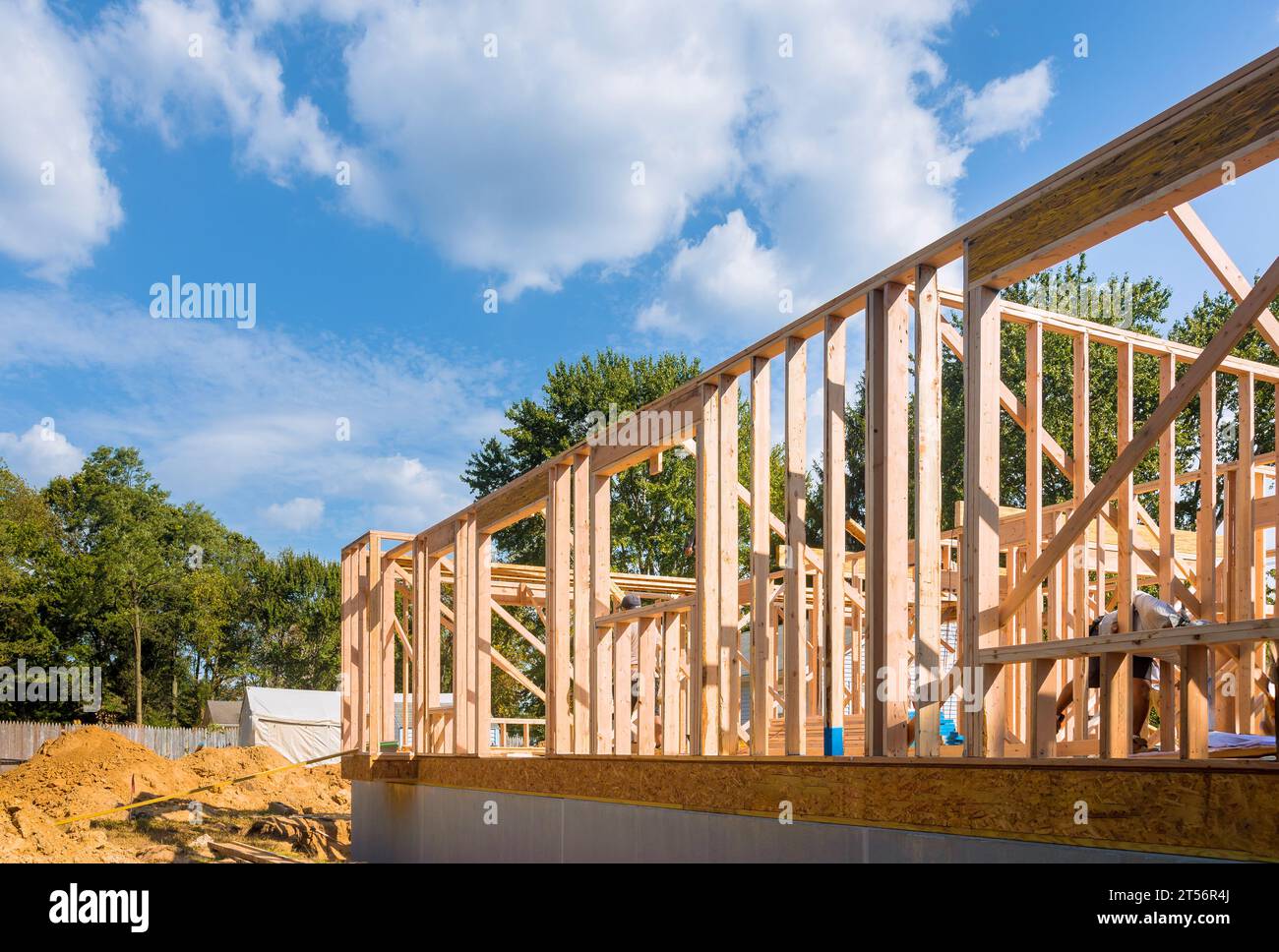 Construction work in progress on an unfinished house with wooden ...