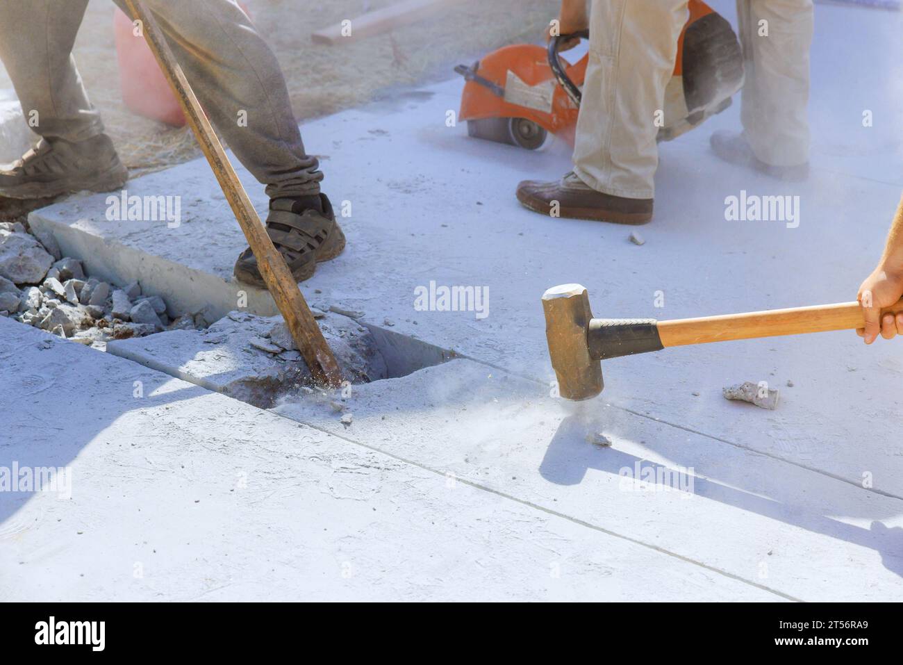 Destruction of old sidewalk pavement concrete repair ongoing in ...