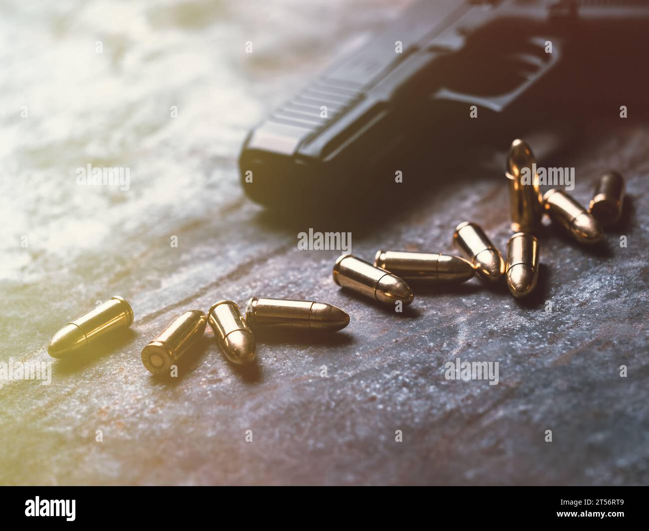 Hand gun with ammunition on dark background. 9 mm pistol military ...