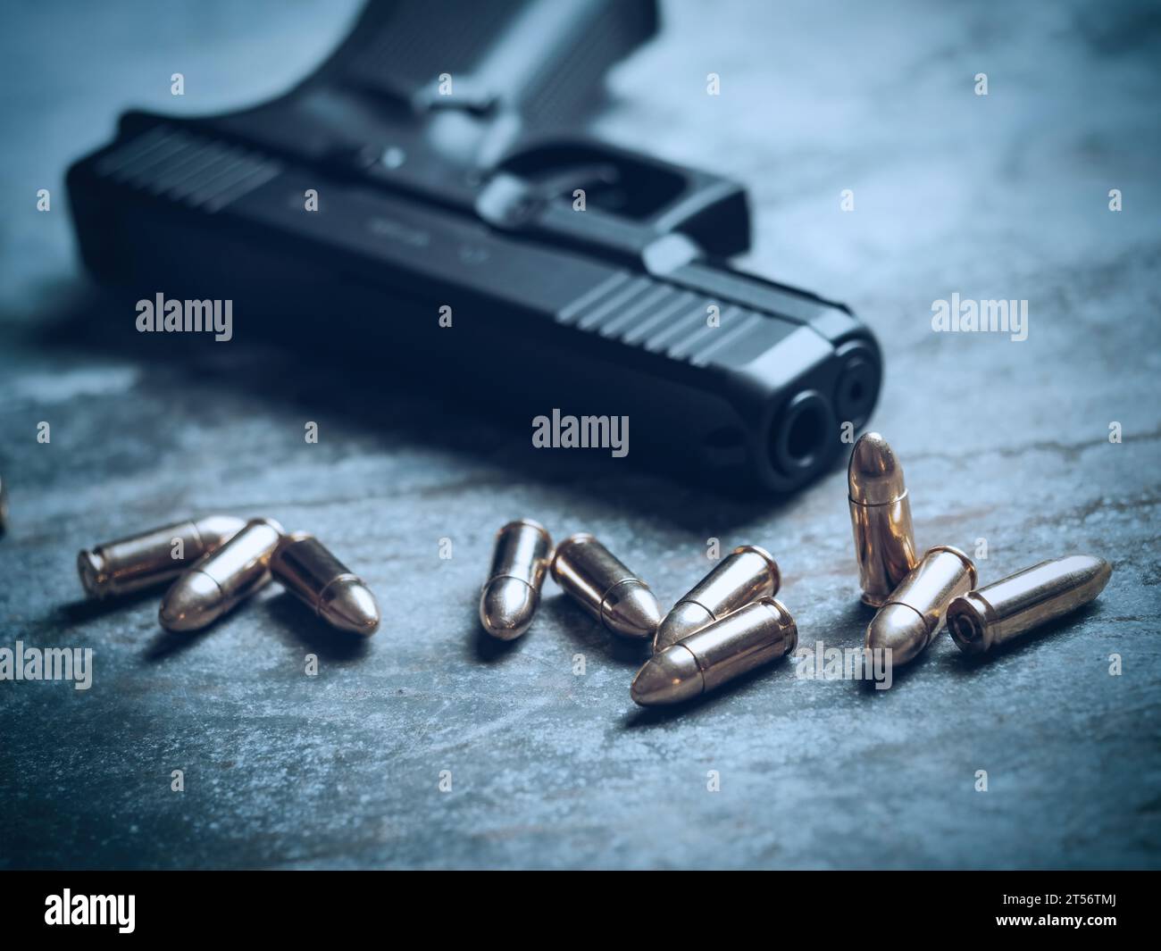 Hand gun with ammunition on dark background. 9 mm pistol military ...