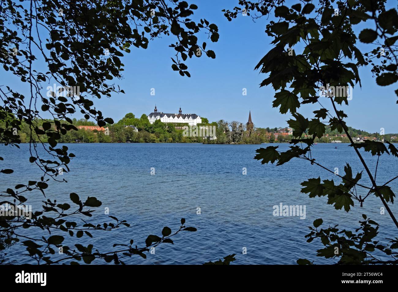 View of the big lake Ploen, the Ploen castle and the St. Nicholas church in Ploen, Schleswig ...
