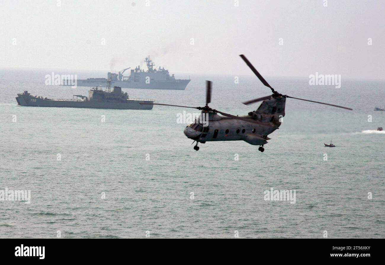 US Navy A CH-46 Sea Knight helicopter flies past the forward-deployed ...