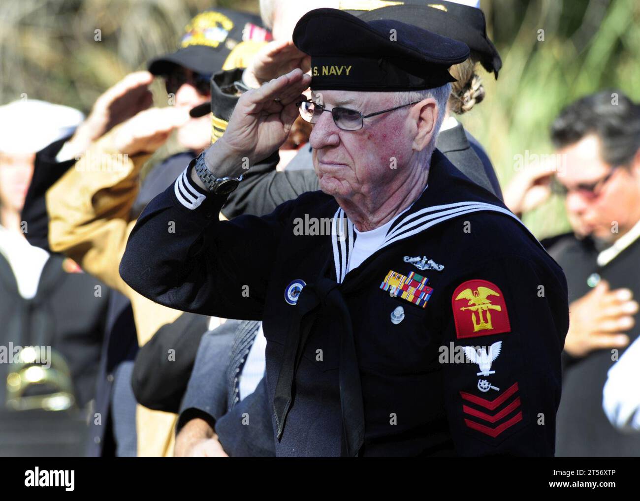 US Navy A former WWII Sailor salutes as taps is played during the Pearl ...