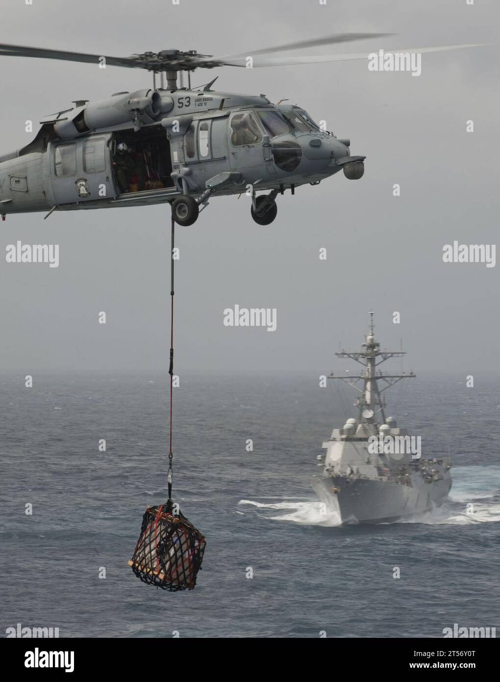 US Navy A helicopter delivers pallets during a vert replenishment at ...