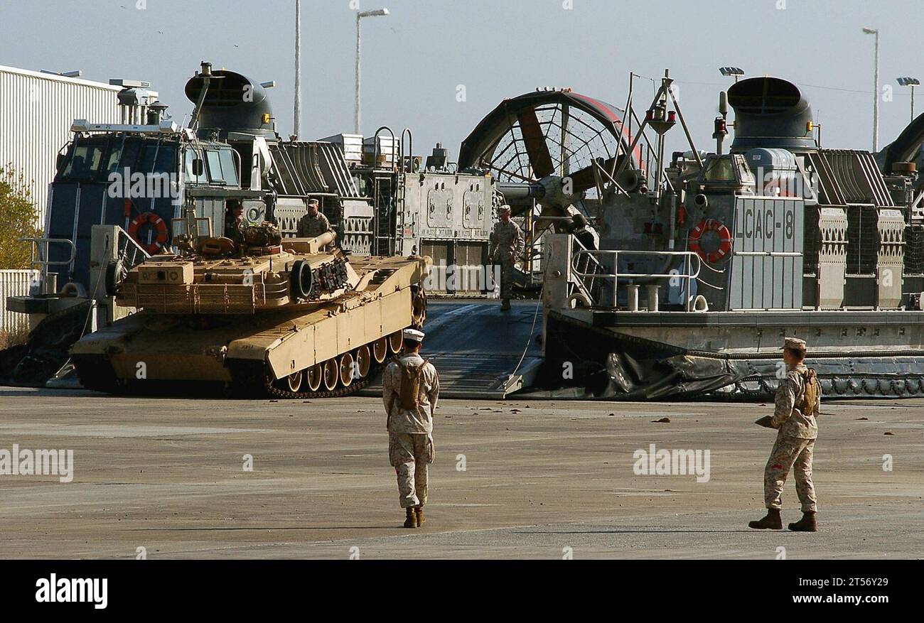 US Navy A landing craft air cushion (LCAC) hovercraft offloads an M-1A1 ...