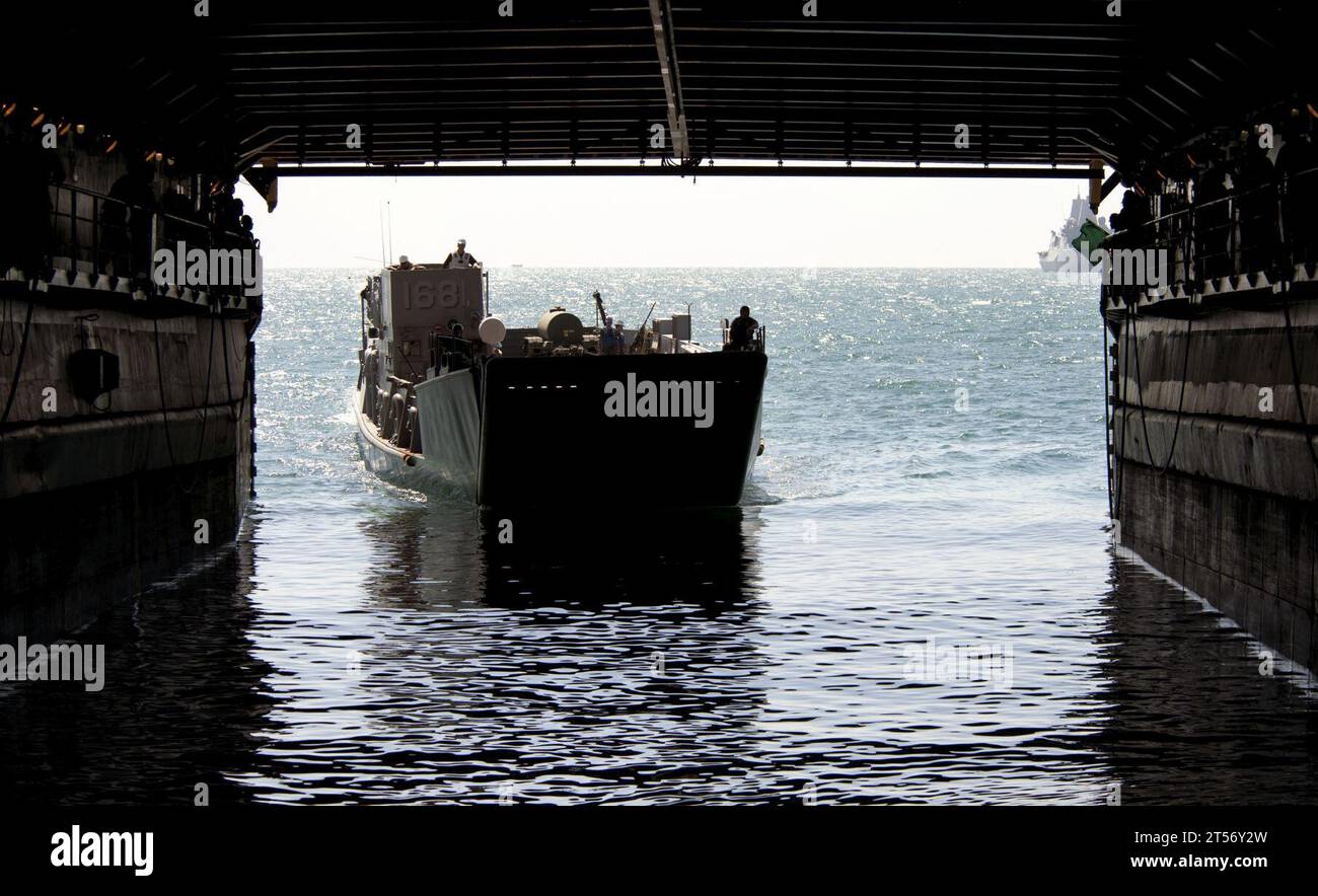 US Navy A landing craft utility approaches the well deck of the ...
