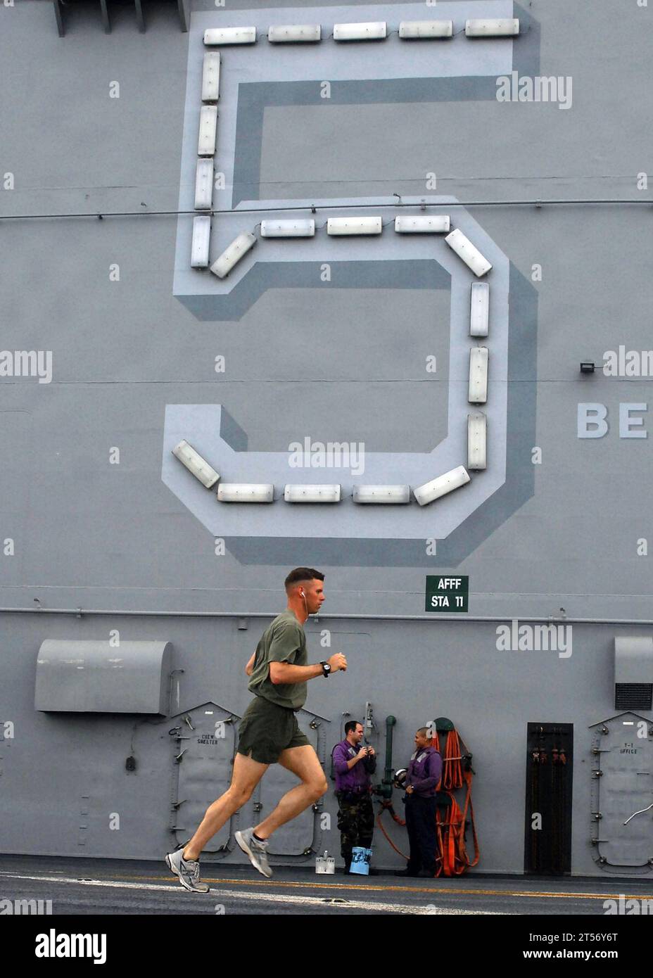 US Navy A Marine takes advantage of a break in flight operations for a ...