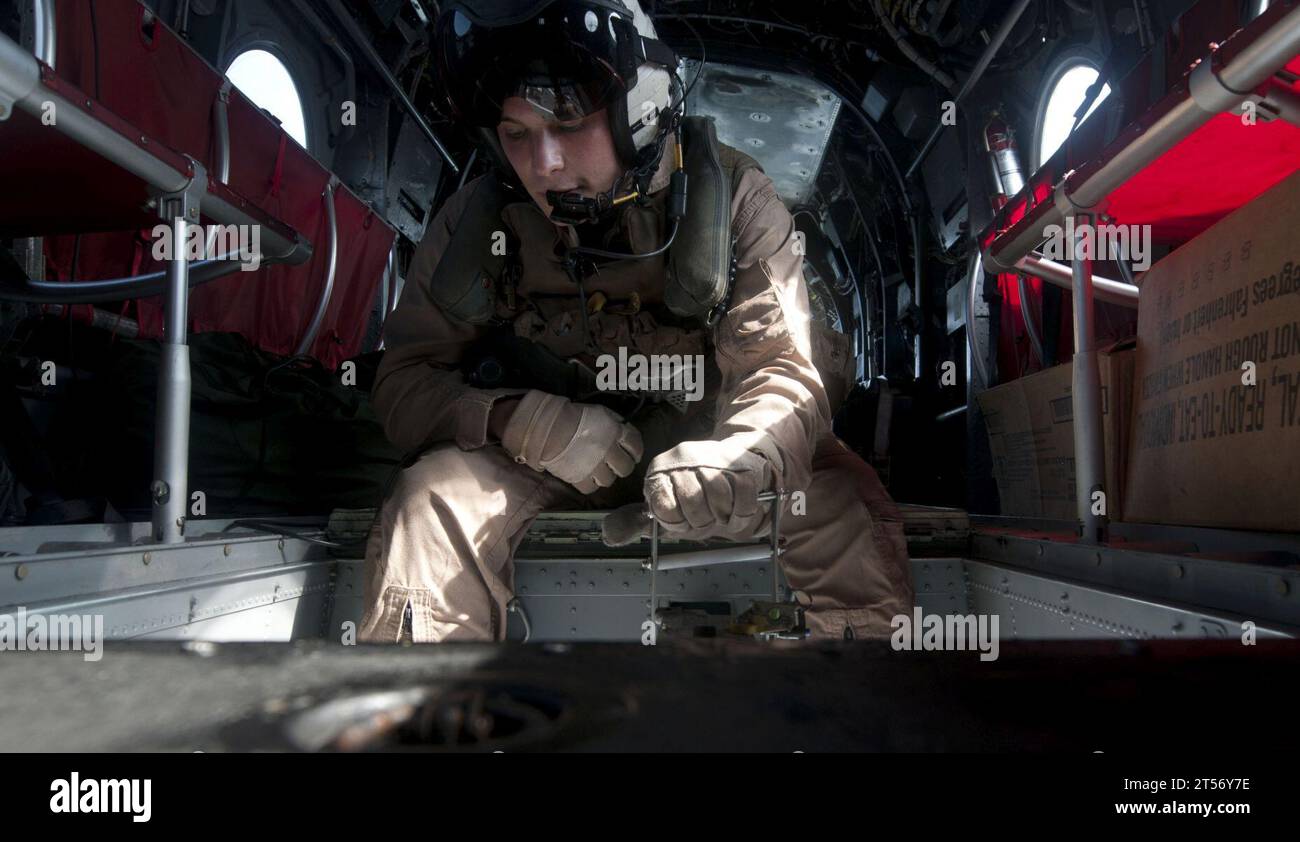 US Navy A Marine relays a message to releases cargo onto the flight ...