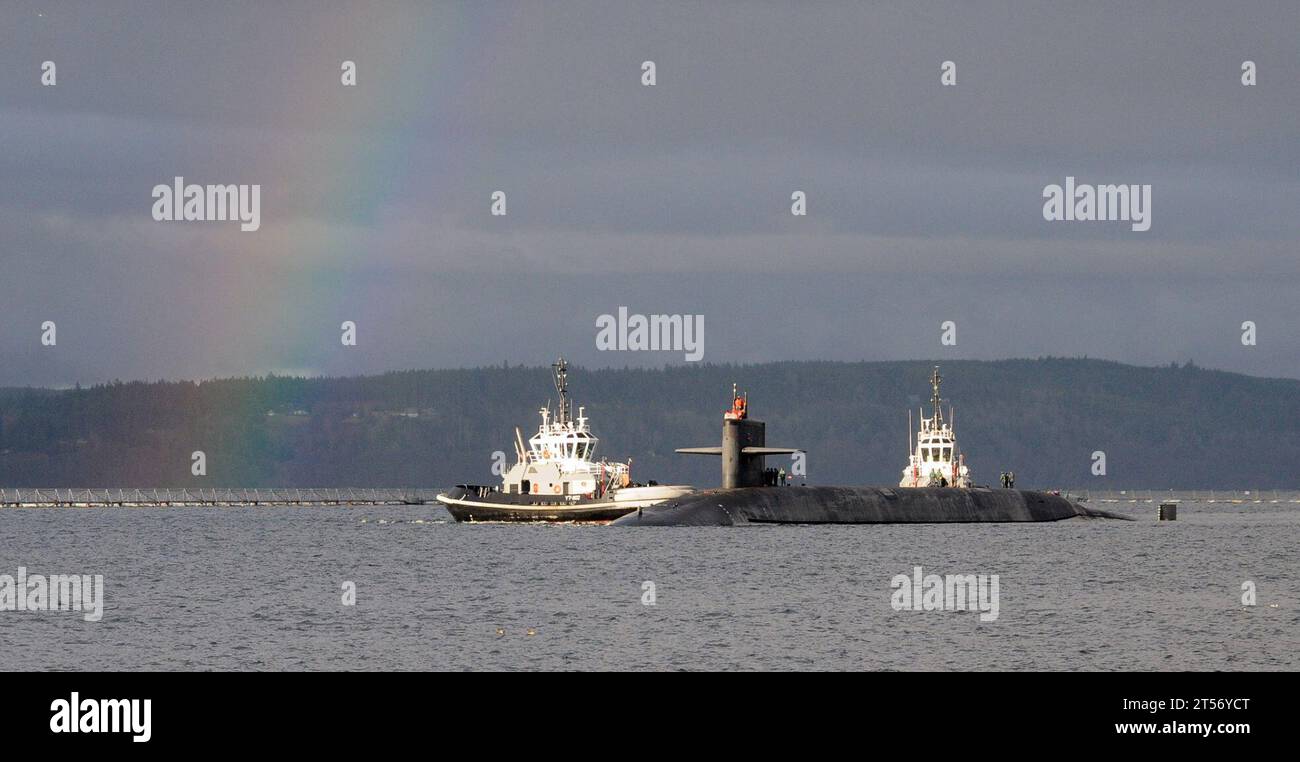 US Navy A rainbow appears off the bow of the Ohio-class ballistic ...