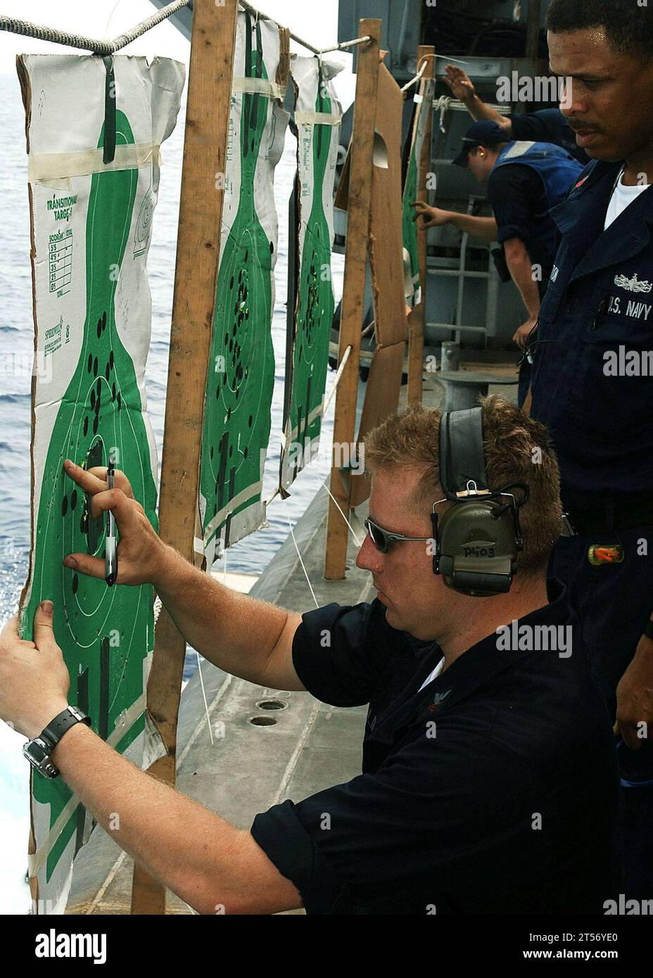 US Navy A sailor aboard High Speed Vessel (HSV) 2 Swift fires an M9 ...