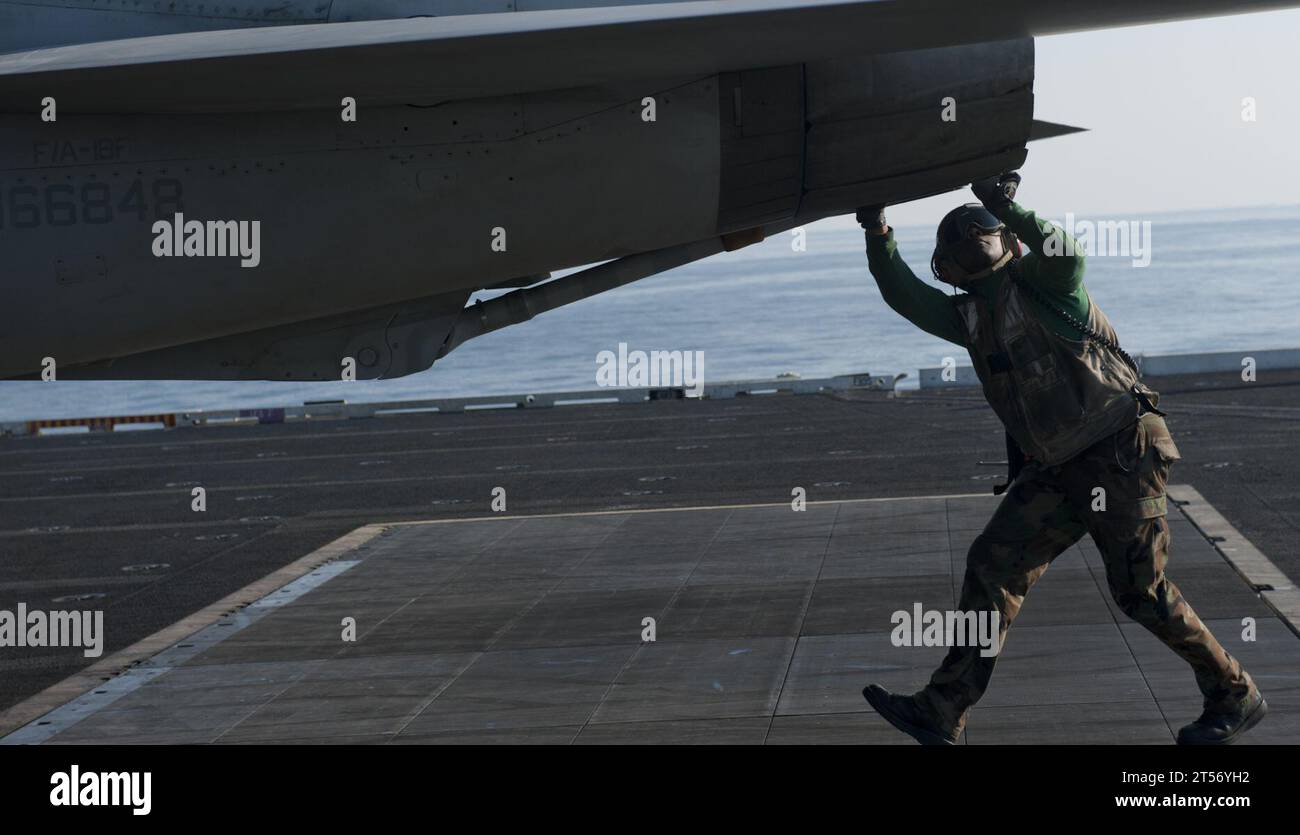 US Navy A Sailor checks the tail hook of an F18F Super Hornet from the ...
