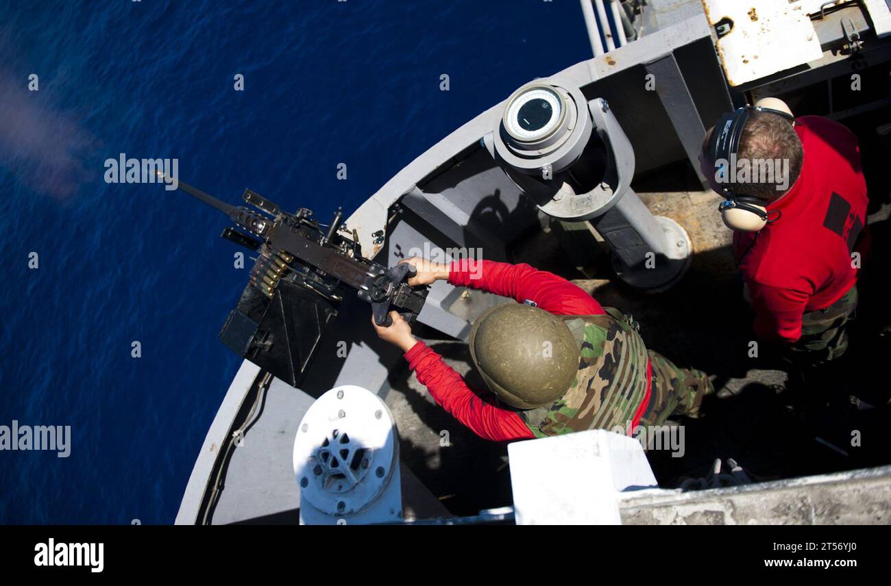 US Navy A Sailor fires a .50-caliber machine gun during a live-fire ...