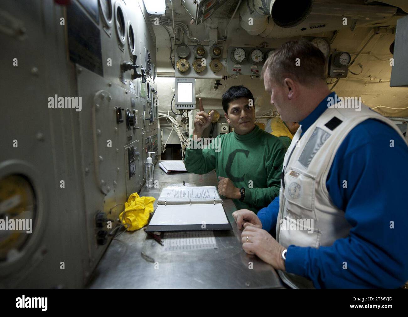 US Navy A Sailor discusses catapult operations with Rear Adm. Thomas K ...