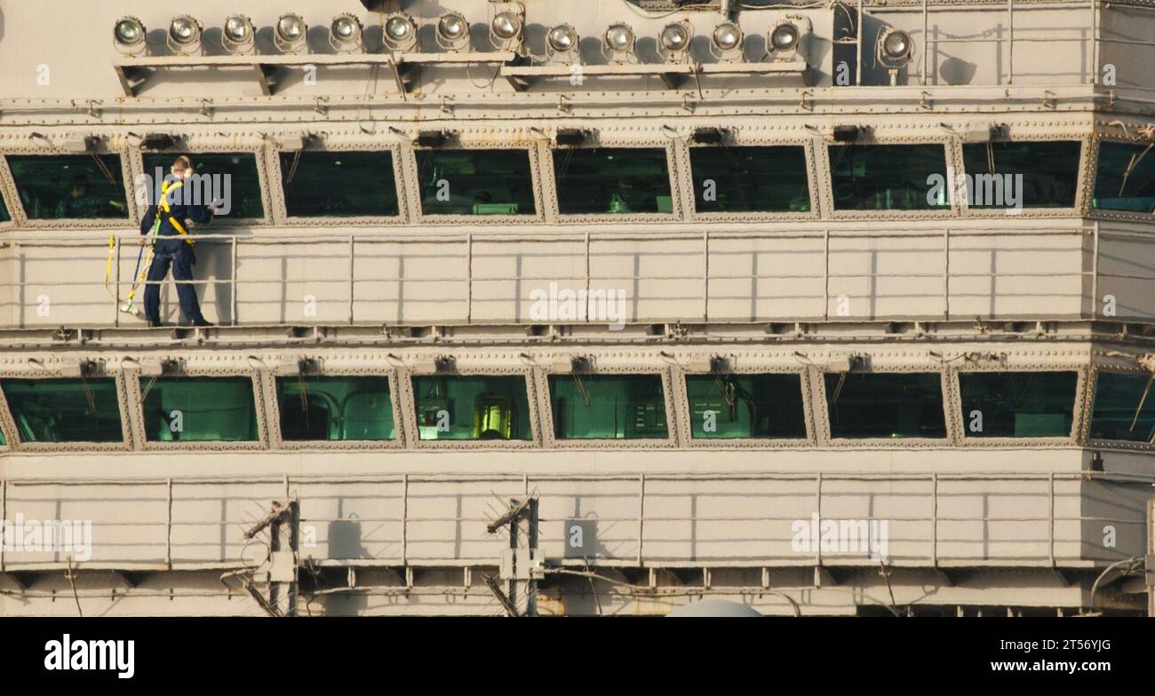 US Navy A Sailor cleans the windows on the island aboard the Nimitz ...