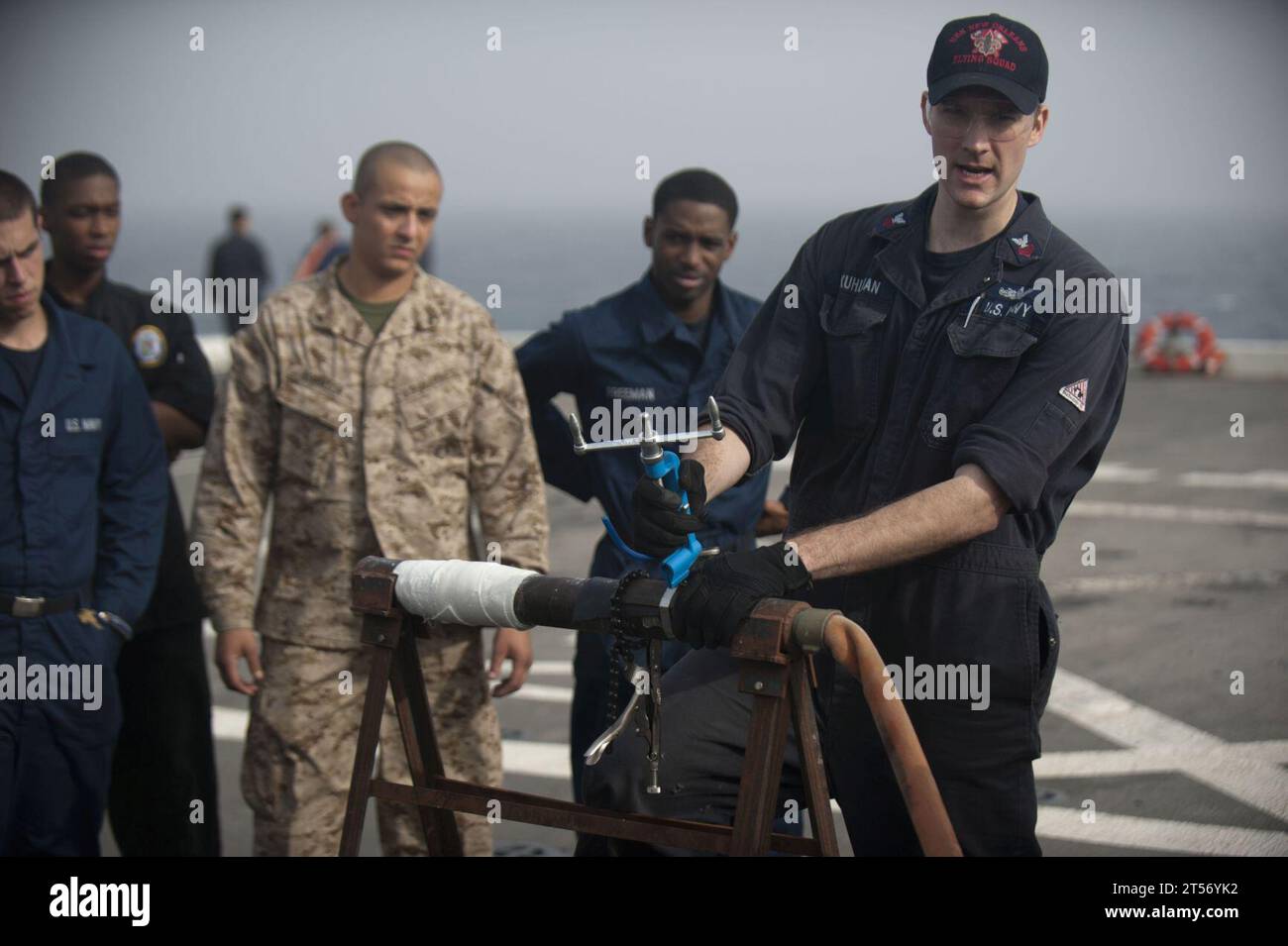 US Navy A Sailor demonstrates how to properly patch a pipe during a ...